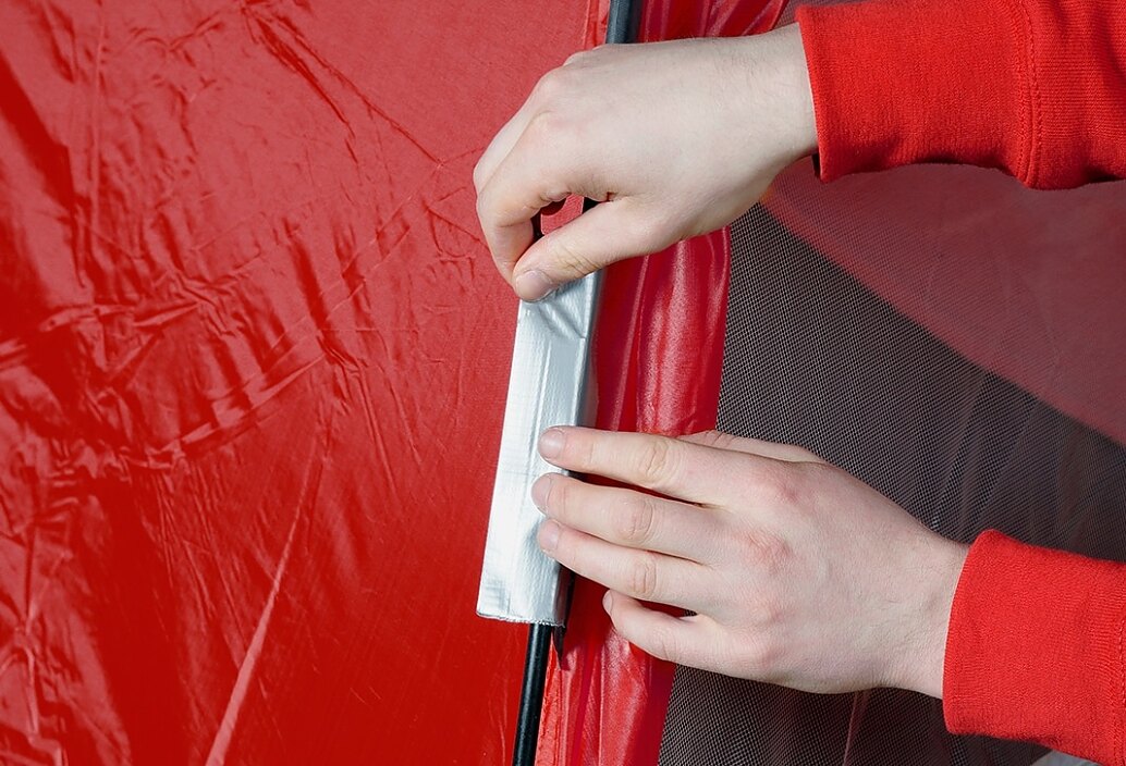 Repairing a tent at the festival - tesa